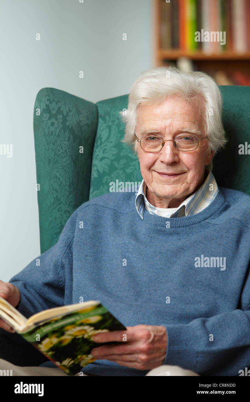 Senior man reading book, portrait Stock Photo - Alamy