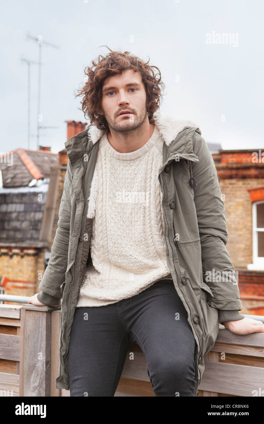 Young man on rooftop, portrait Stock Photo - Alamy