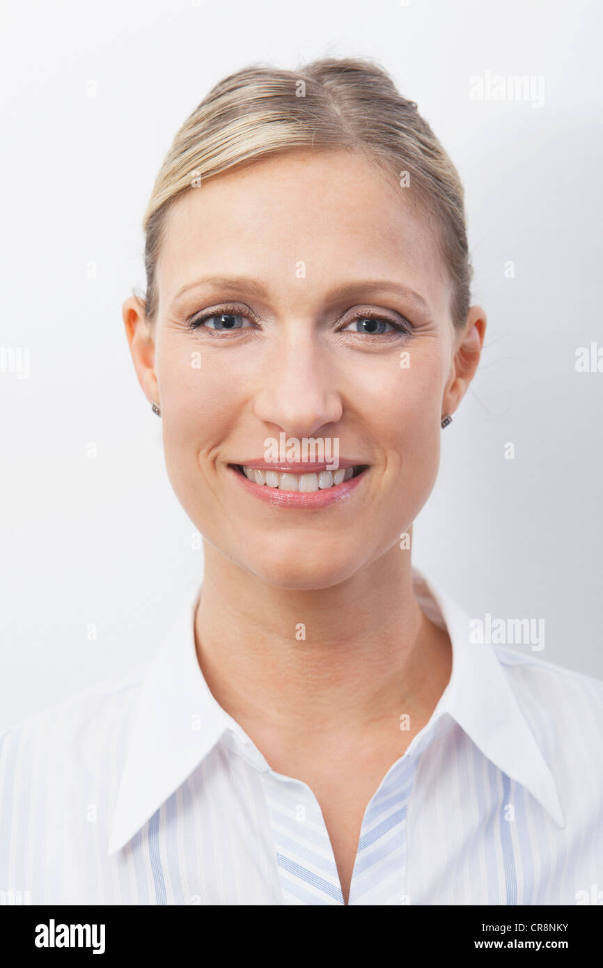 Mid adult woman smiling, portrait Stock Photo - Alamy