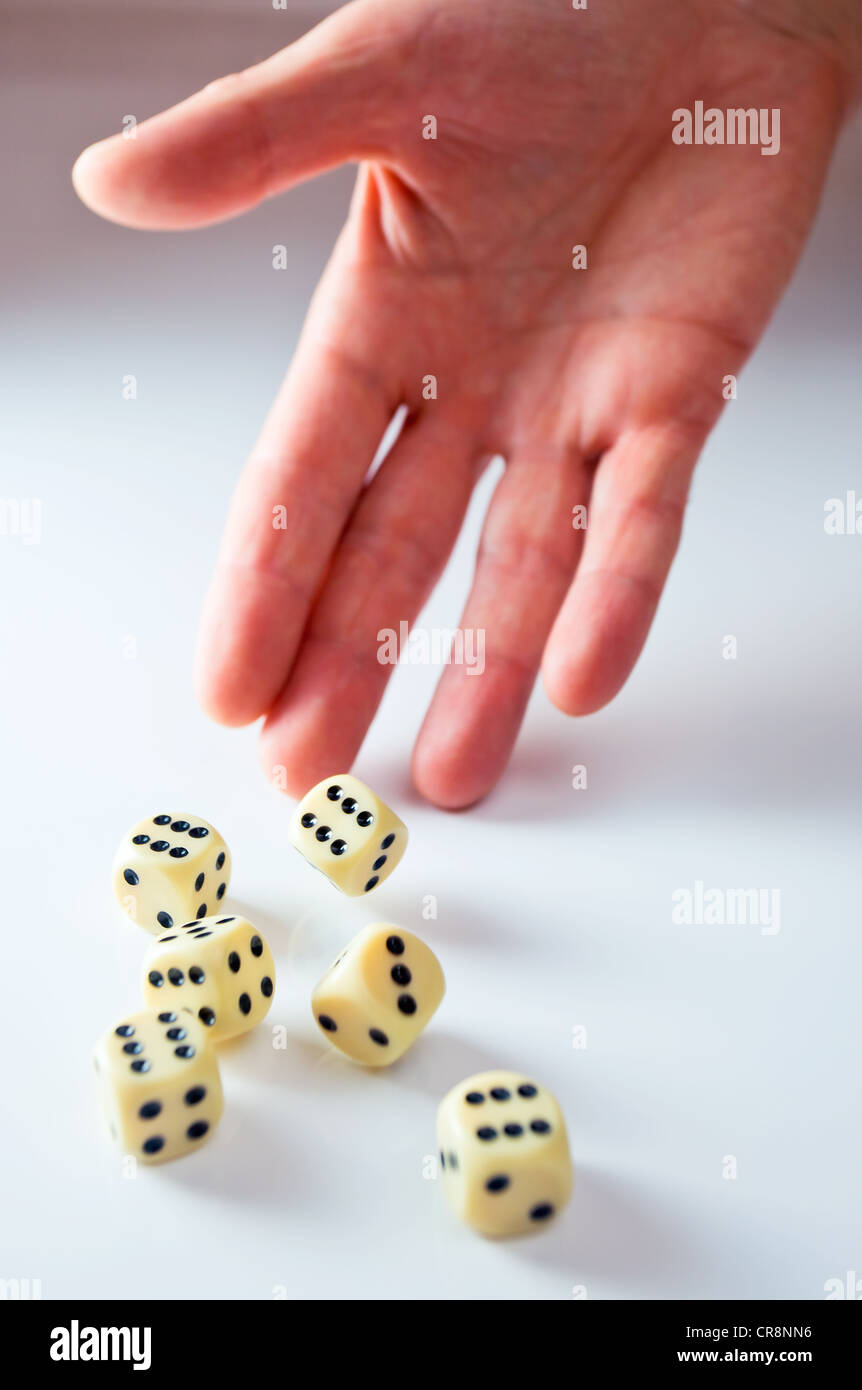 The hand of the person throwing cubes for dicing Stock Photo - Alamy