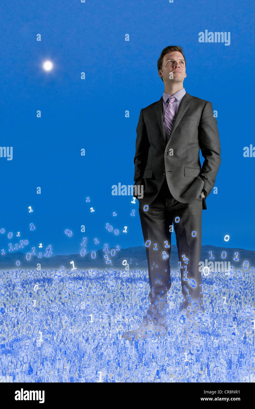 Businessman standing in binary field Stock Photo - Alamy