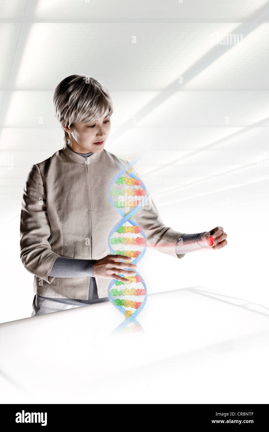 Female scientist interacting with holographic genome Stock Photo - Alamy