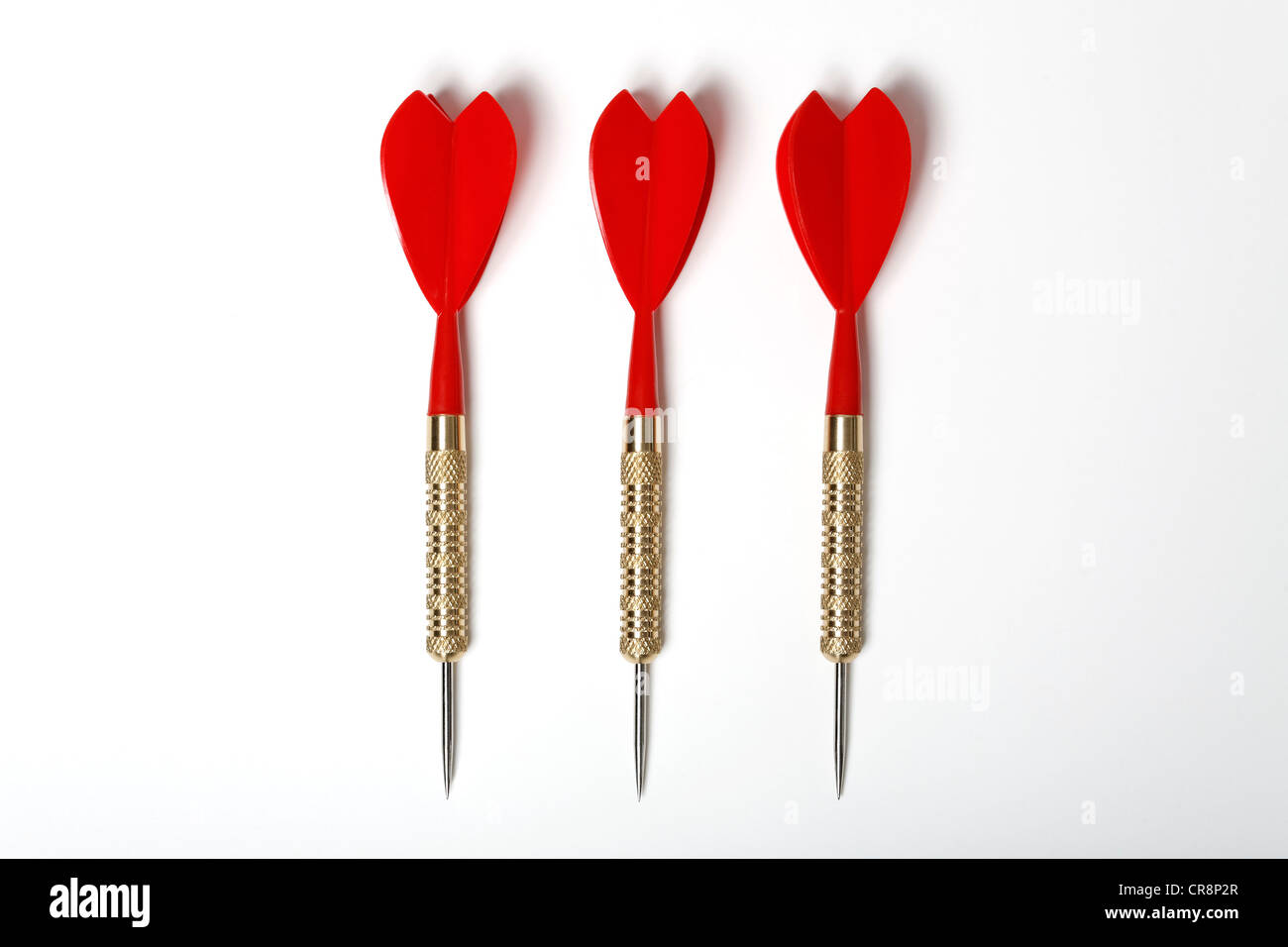 Three red darts Stock Photo - Alamy
