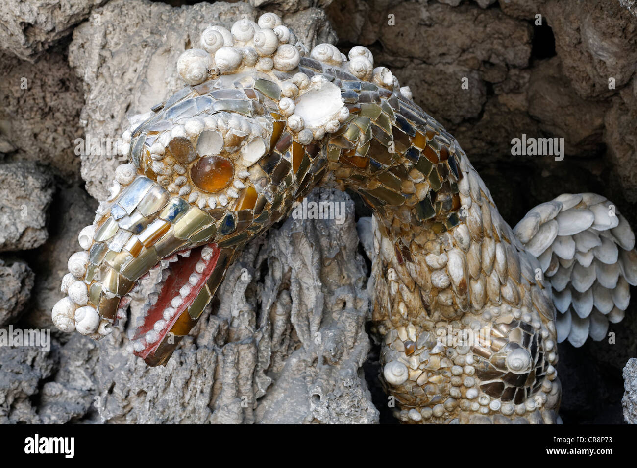Head of a dragon made from shells and snails, decorations in the grotto ...