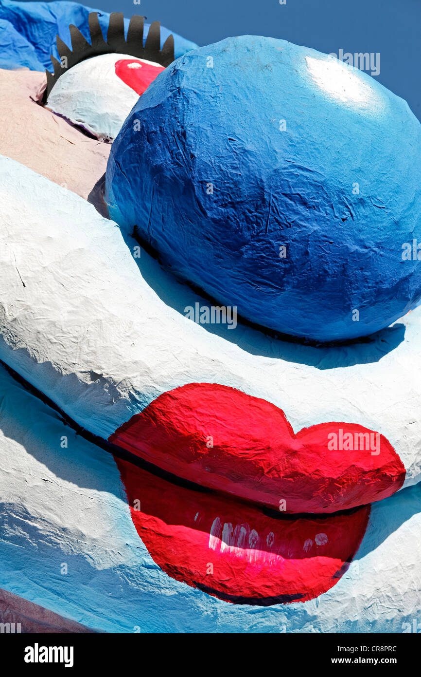 Female clown with a bulbous nose and red lips, paper-mache figure ...