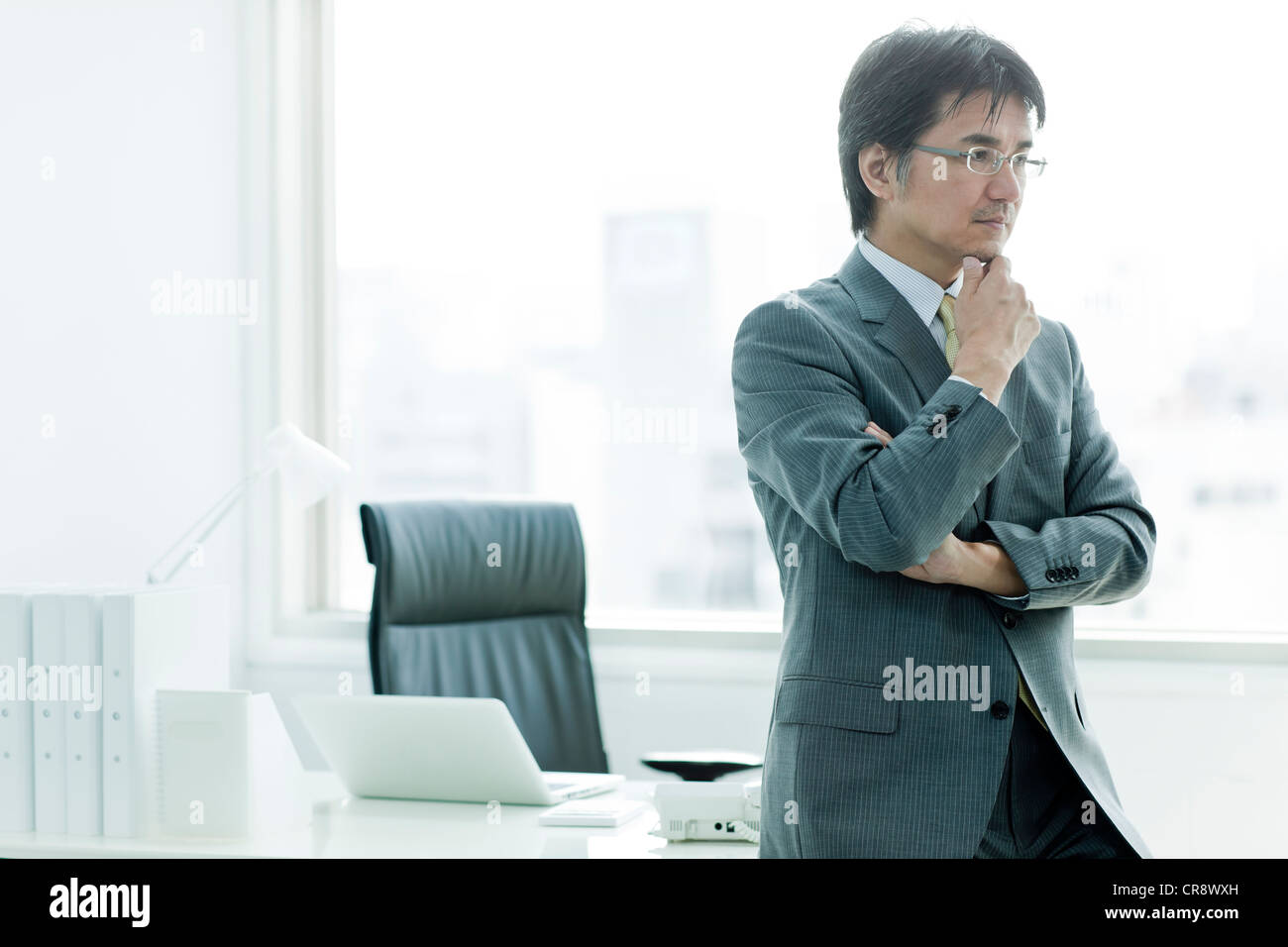 Businessman sat on chair hi-res stock photography and images - Alamy