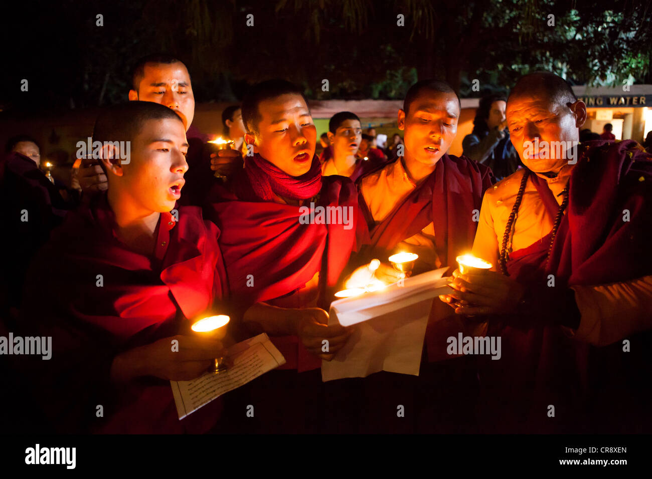 Buddhist monks and pilgrims pray with oil lamp at night , Mahabodhi ...
