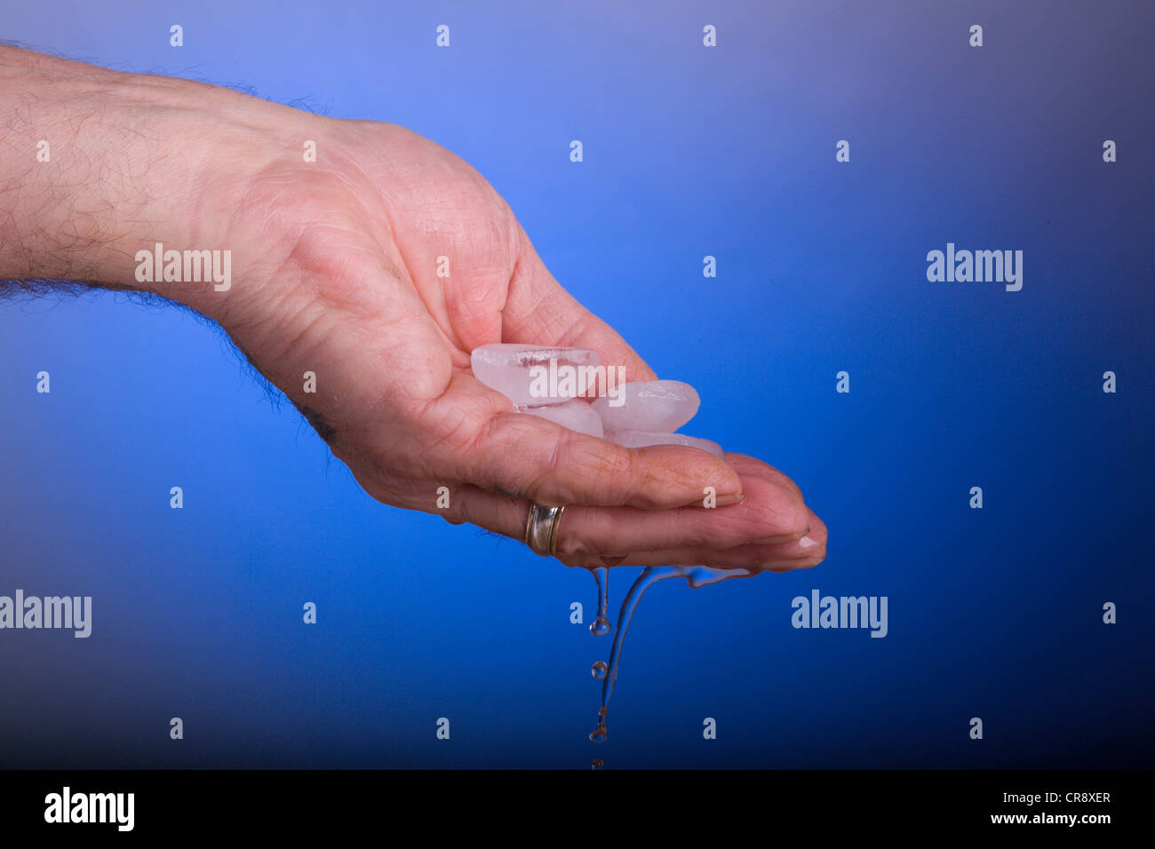 Melting ice cube hand hi-res stock photography and images - Alamy