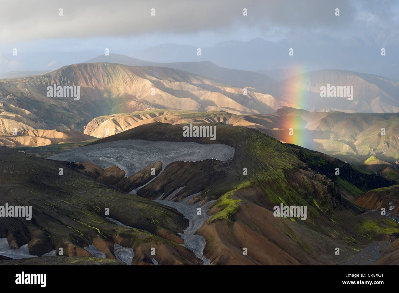 Segment of a rainbow over the rhyolite mountains near the ...