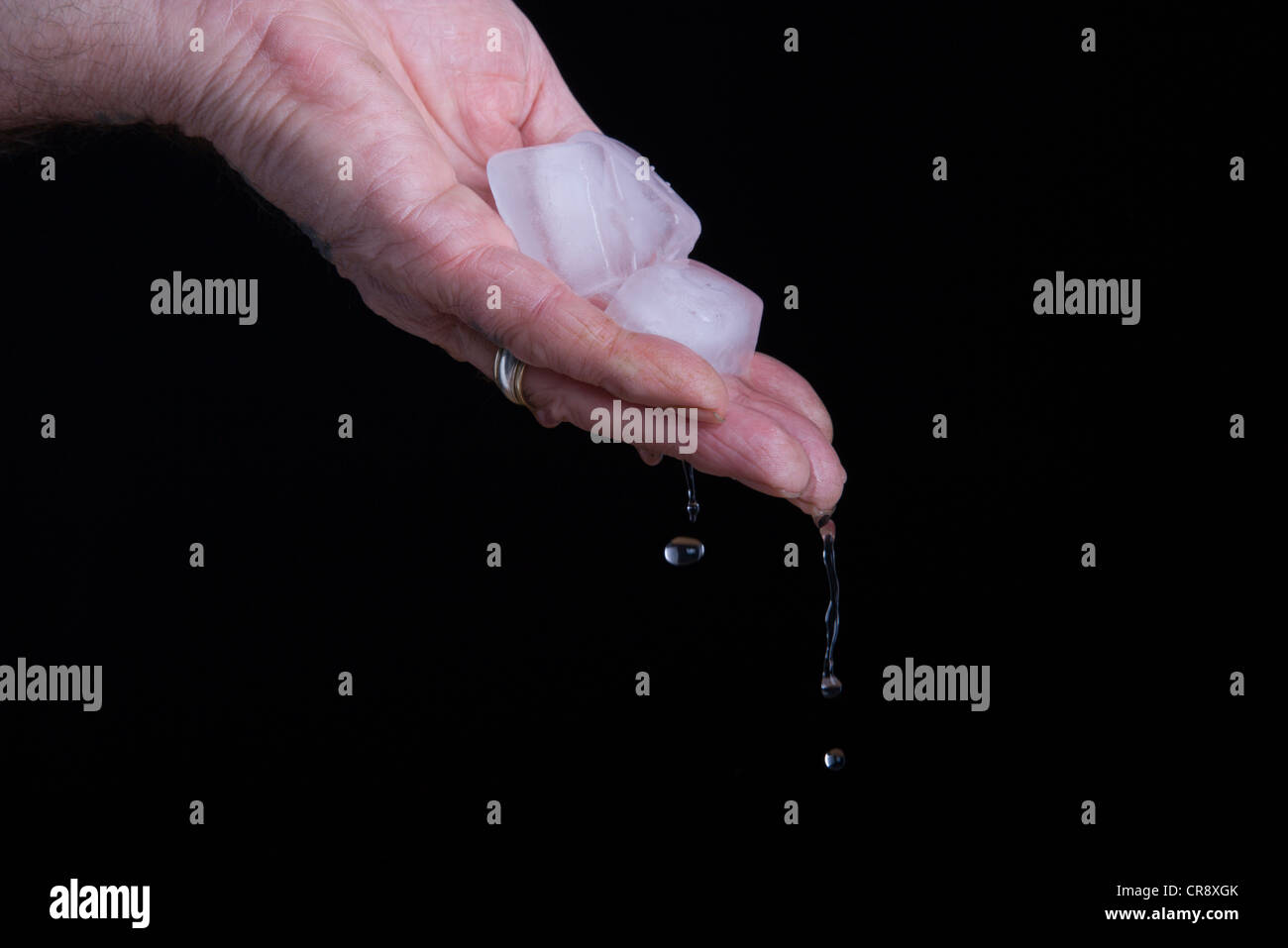 Hand holding melting ice cubes hi-res stock photography and images - Alamy