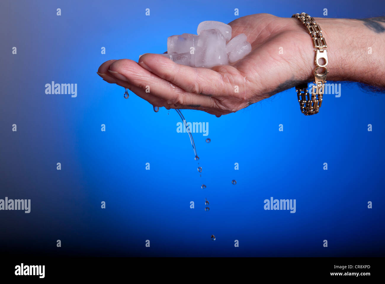 Melting ice cube hand hi-res stock photography and images - Alamy