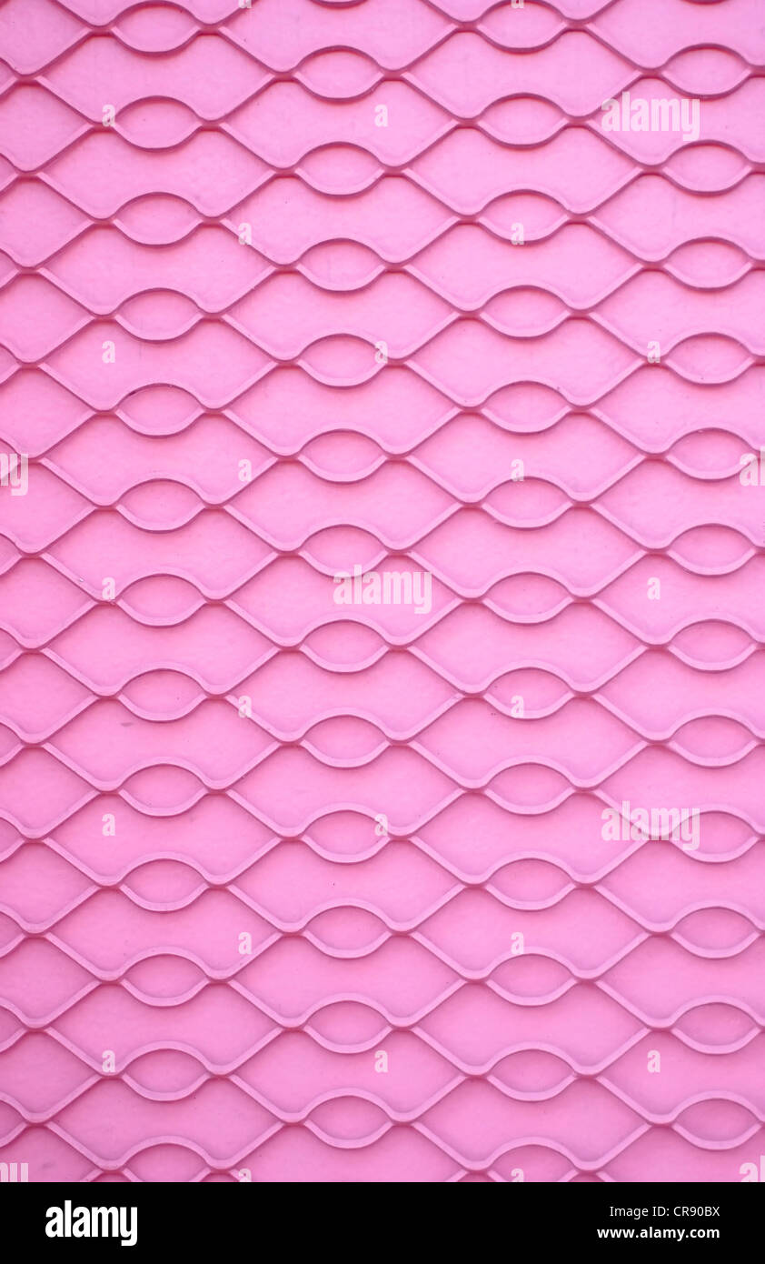 Wire mesh on a wall painted bright pink Stock Photo - Alamy