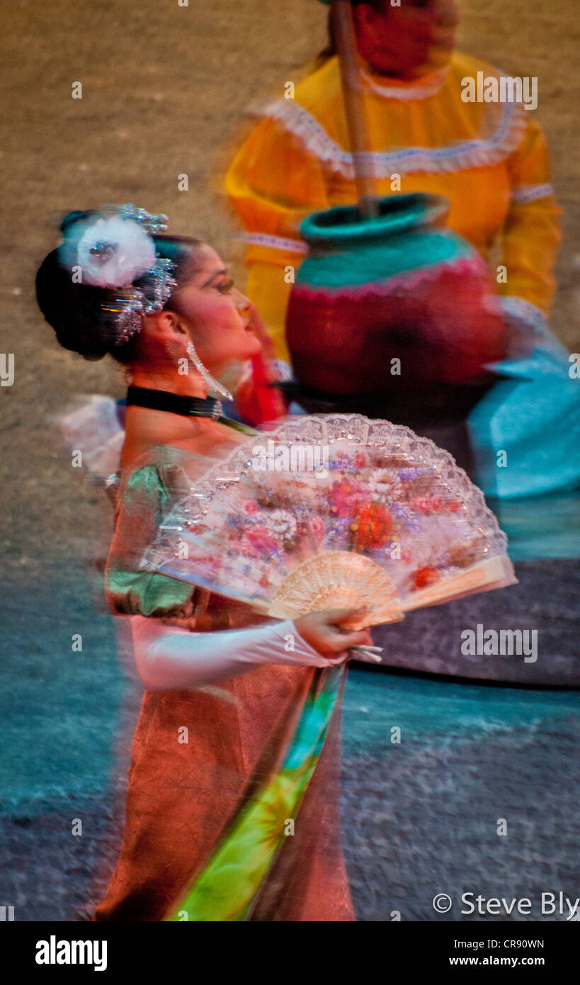 Beautiful Maya Dancer in traditional dress performing a folklore dance ...