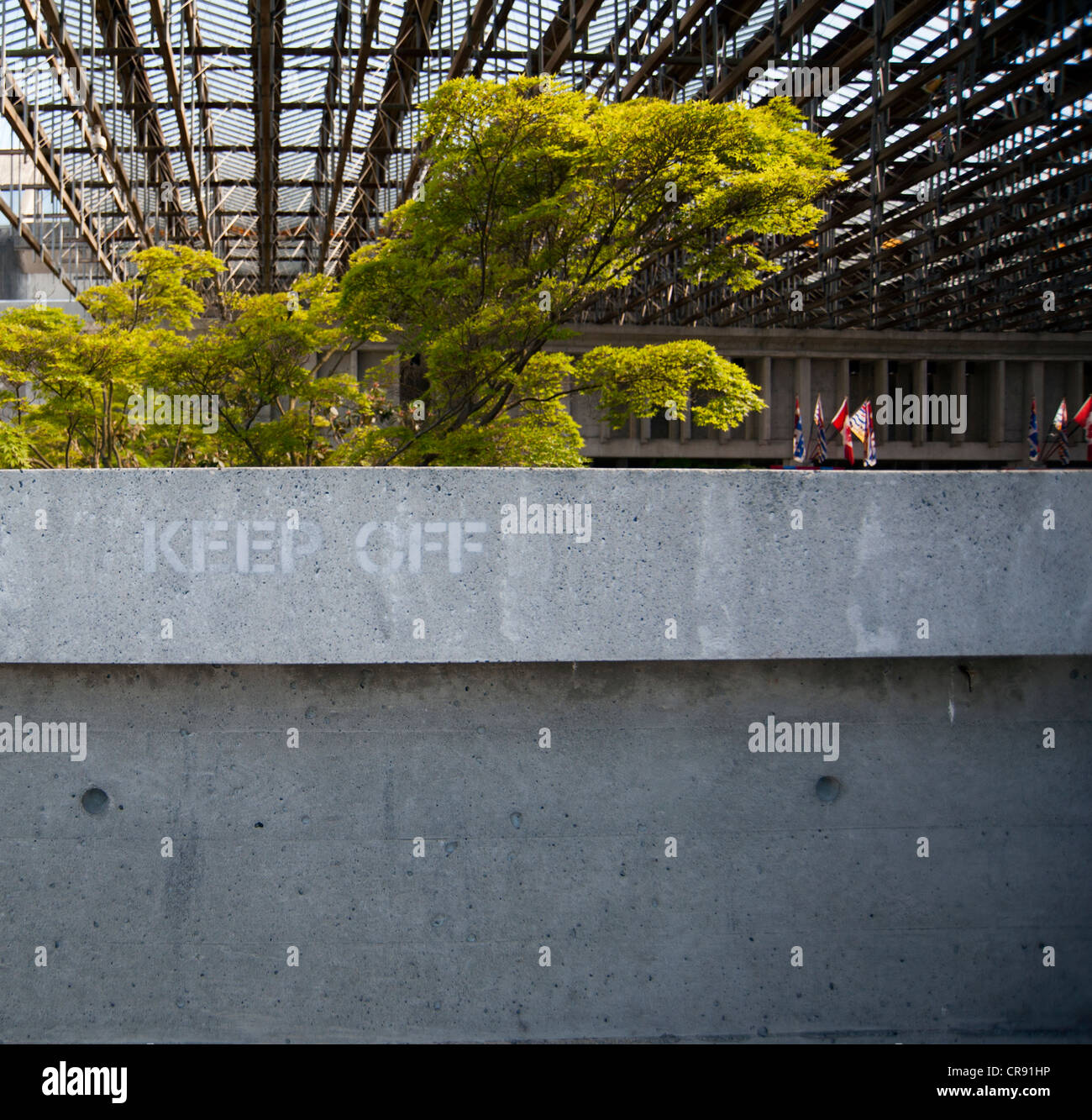 Keep off sign on a cement wall Stock Photo - Alamy
