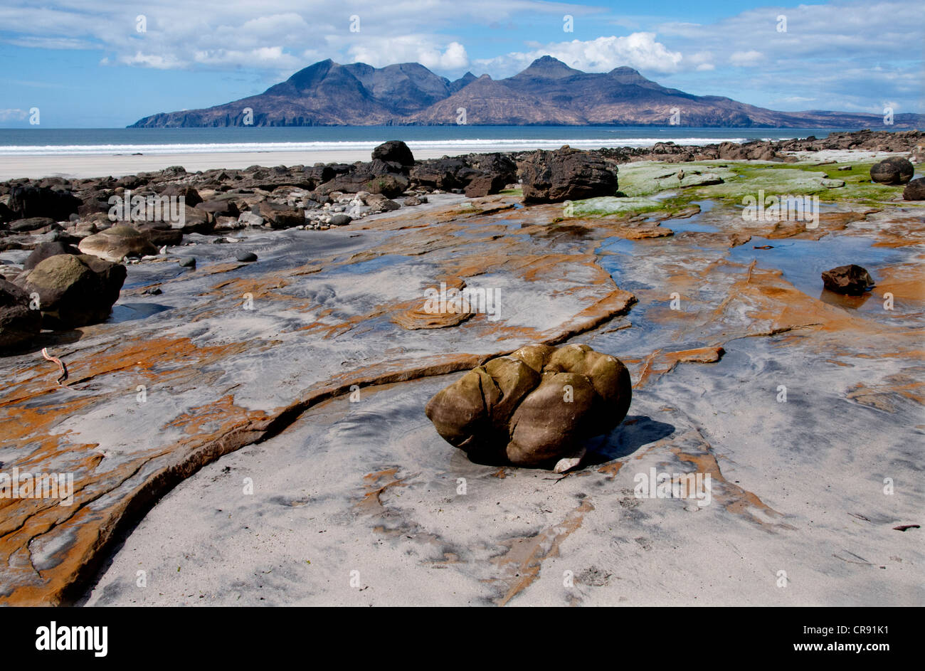 a landscape of bay of laig isle of eigg and the isle of rum in the back ...