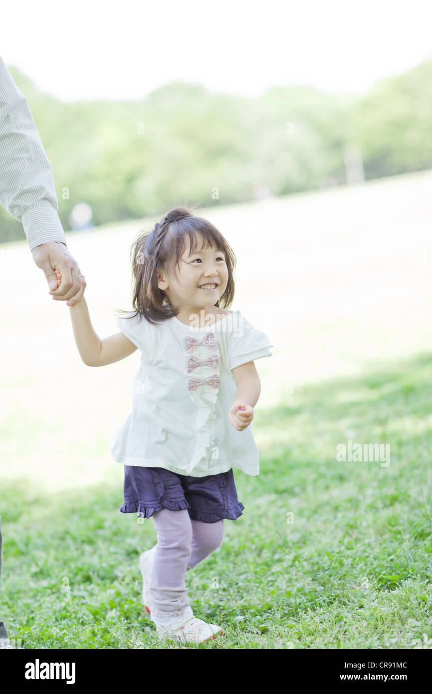 A family holding hands Stock Photo - Alamy