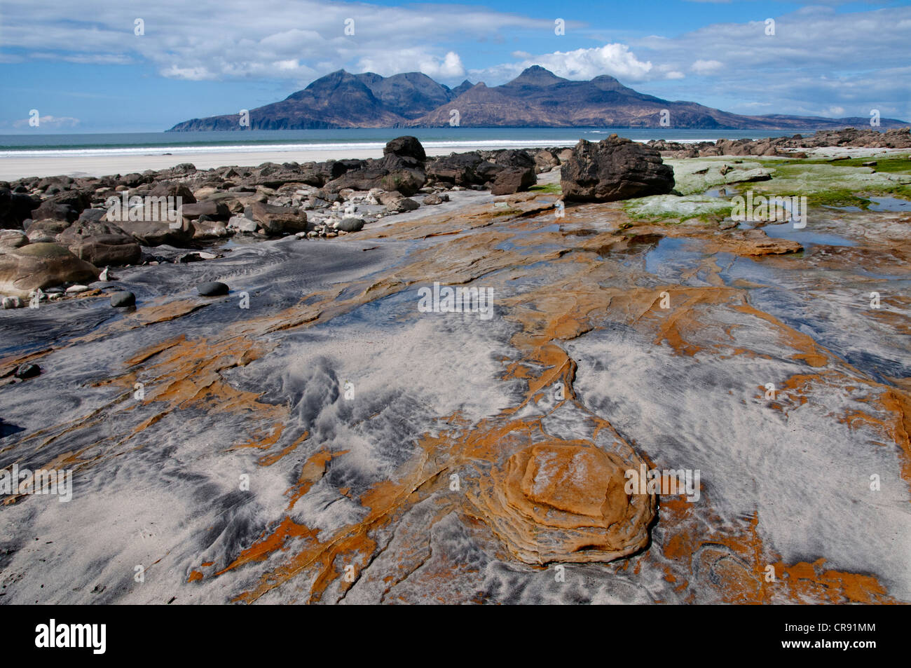 a landscape of bay of laig isle of eigg with the isle of rum in the ...
