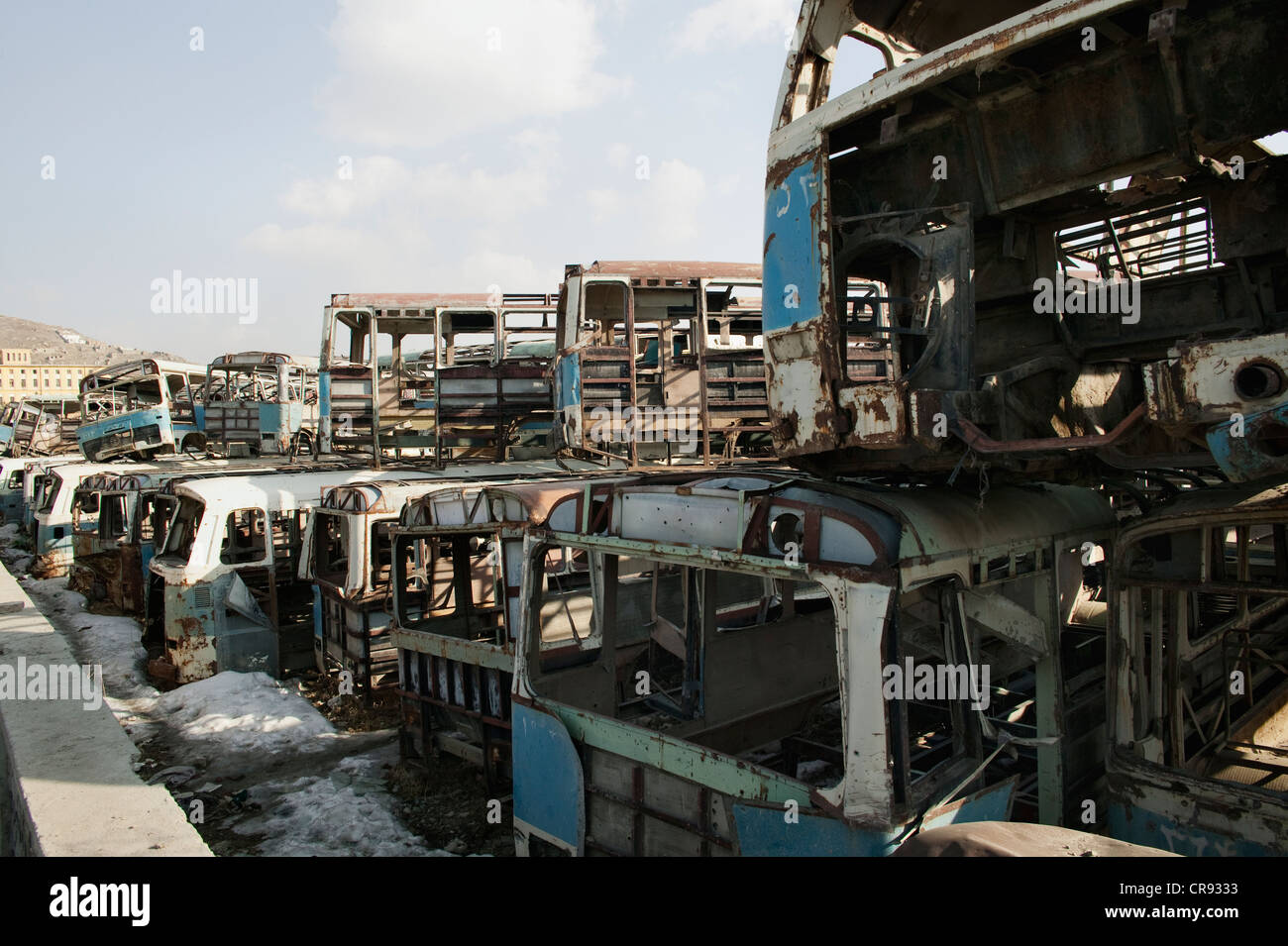 The effect of the conflict in Afghanistan. Stacked ruined buses and ...