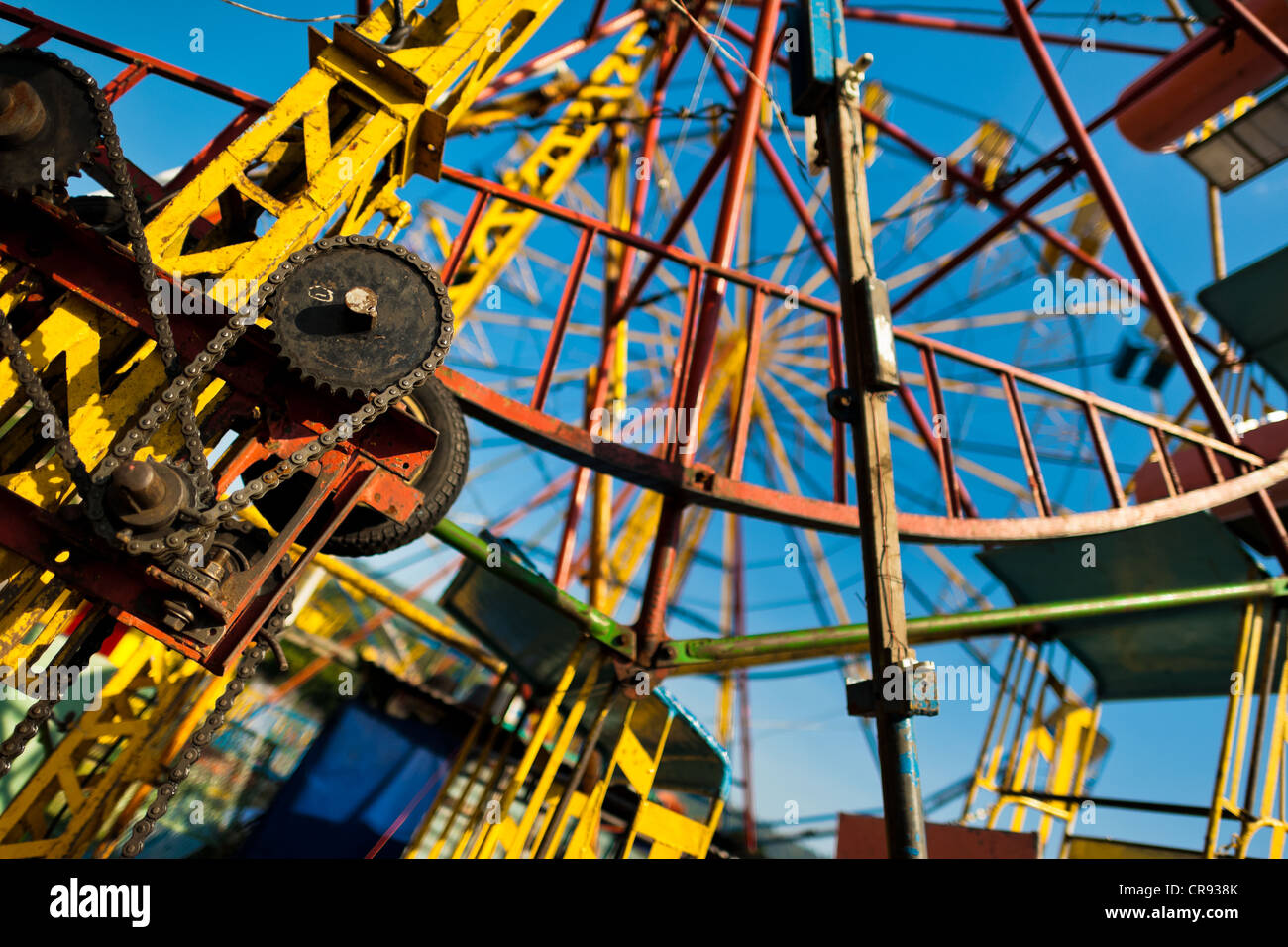 Gear wheels of the ferris wheel seen at a village fair in the ...