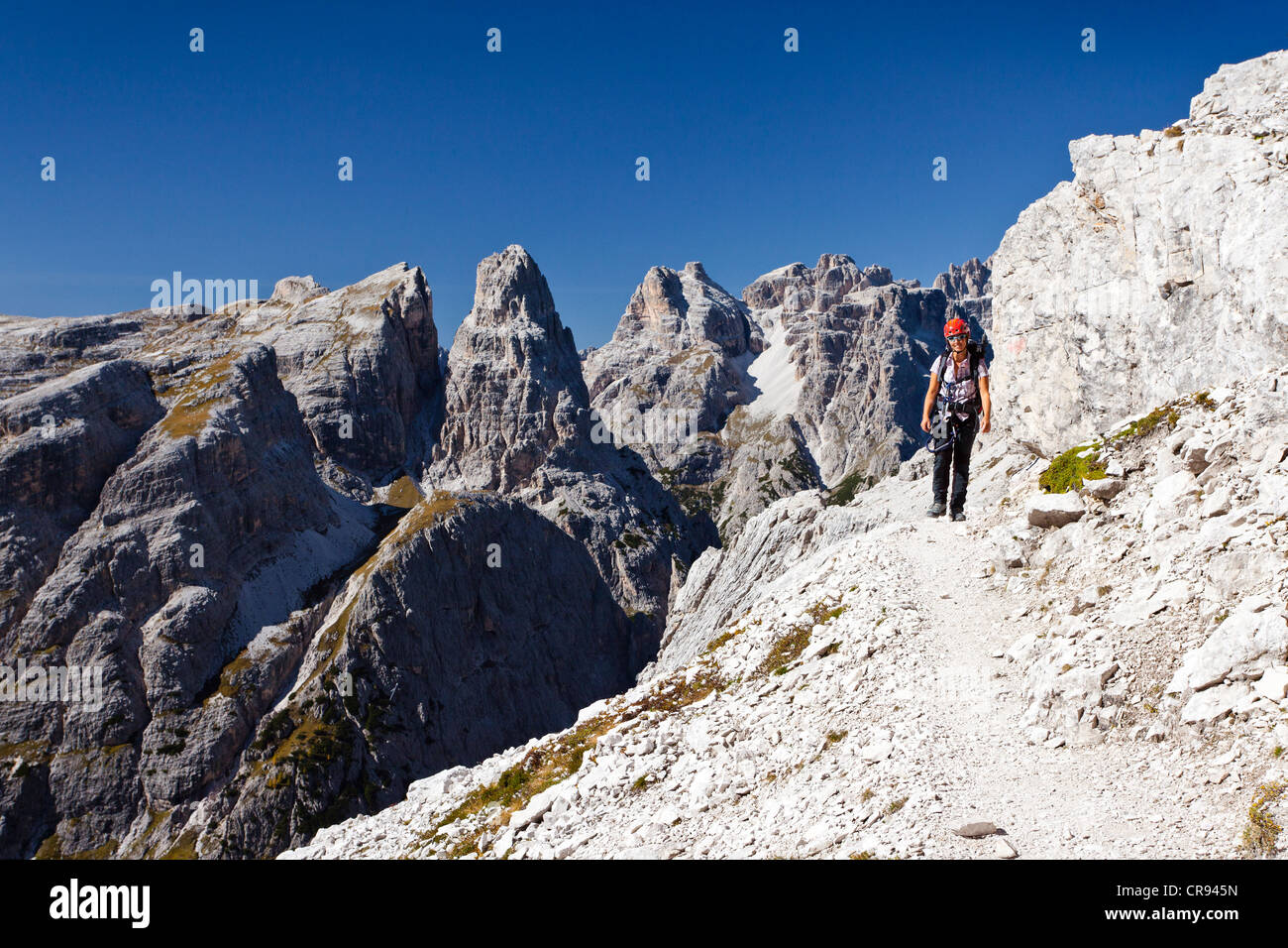 Hiker ascending the Alpinisteig climbing route on Einser Mountain ...