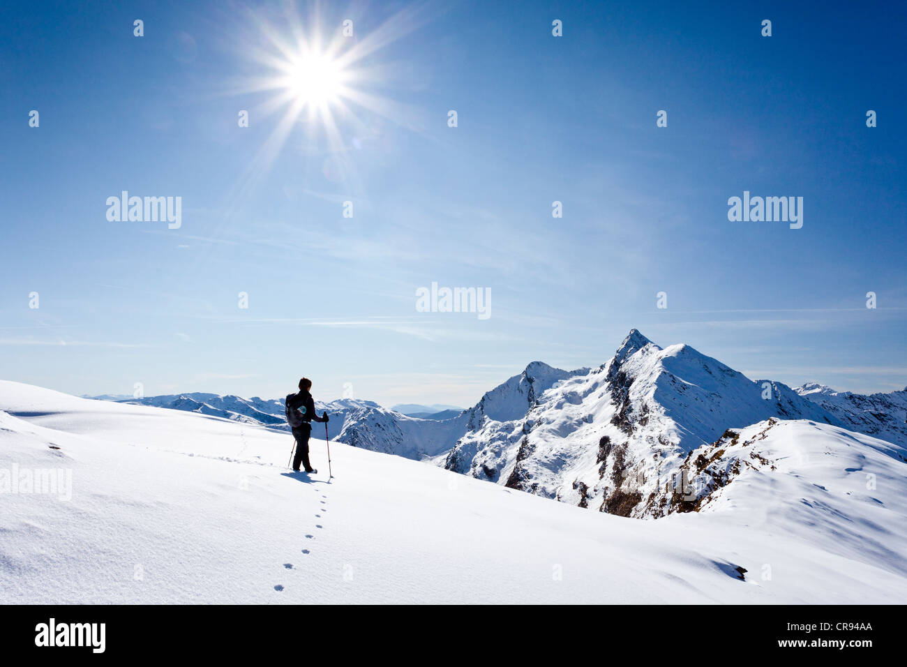 Hiker on Roethenspitz Mountain above Penser Joch Pass, looking towards ...