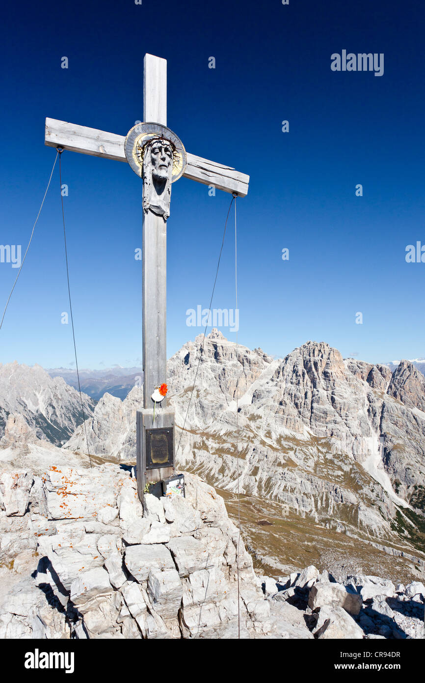 Summit cross on Paternkofel Mountain, overlooking Dreischusterspitze ...