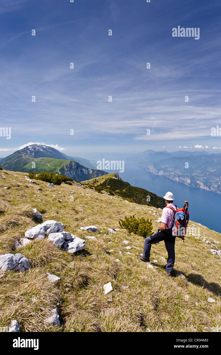 Hiker on Mt Monte Altissimo, above Nago-Torbole, Lake Garda below, Mt ...