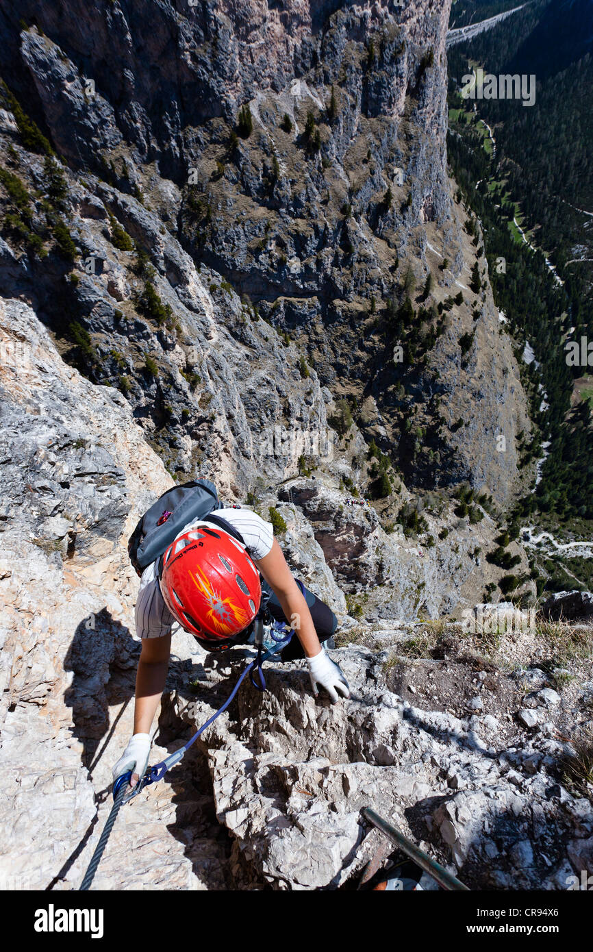 Mountain climber ascending the Stevia climbing route in Vallunga Valley ...