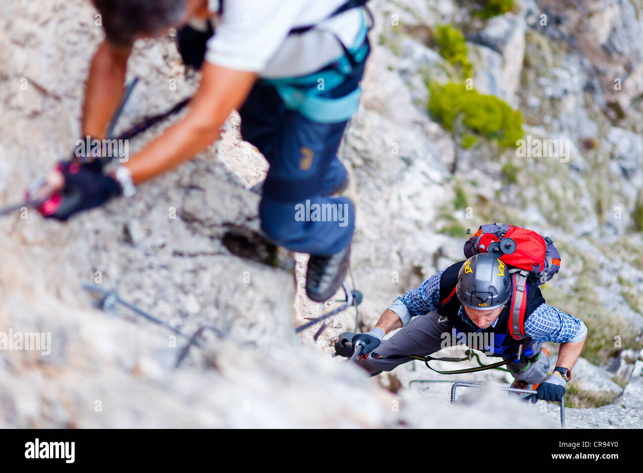 Mountain climbers climbing the Stevia climbing route in Vallunga Valley ...