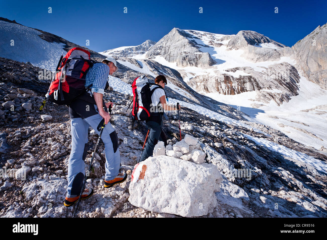 Mountain climbers ascending towards Marmolada Mountain on the Westgrat ...