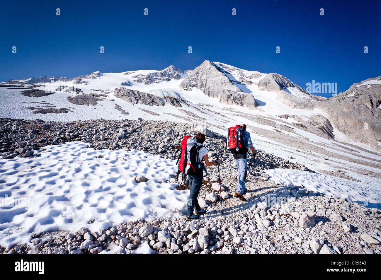 Mountaineers climbing Marmolada mountain, Dolomites, Westgrat fixed ...