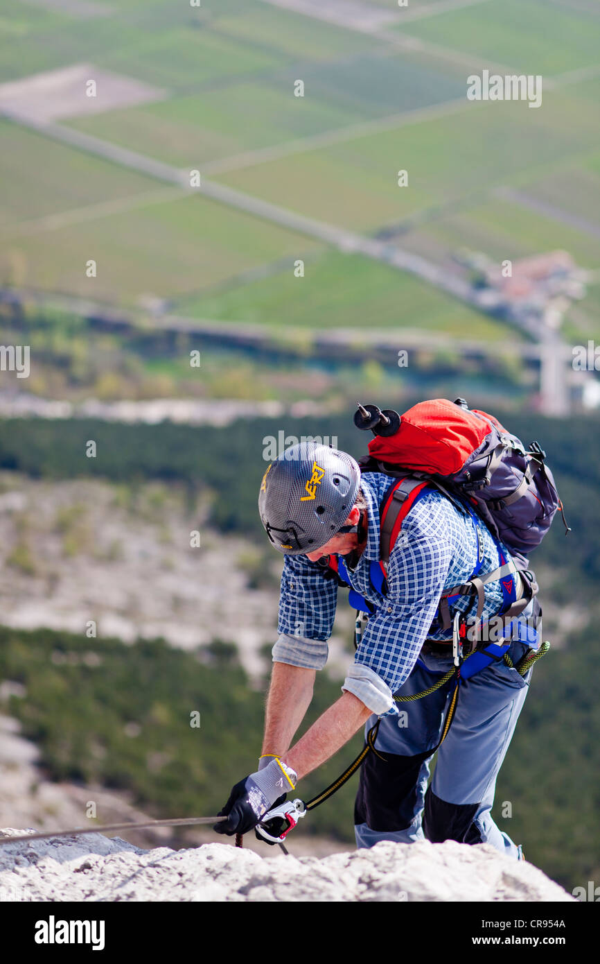 Climber climbing on the Che Guevara fixed rope route on Casale mountain ...