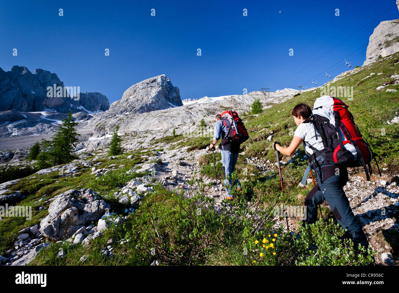 Mountaineers climbing Marmolada mountain, Dolomites, Westgrat fixed ...