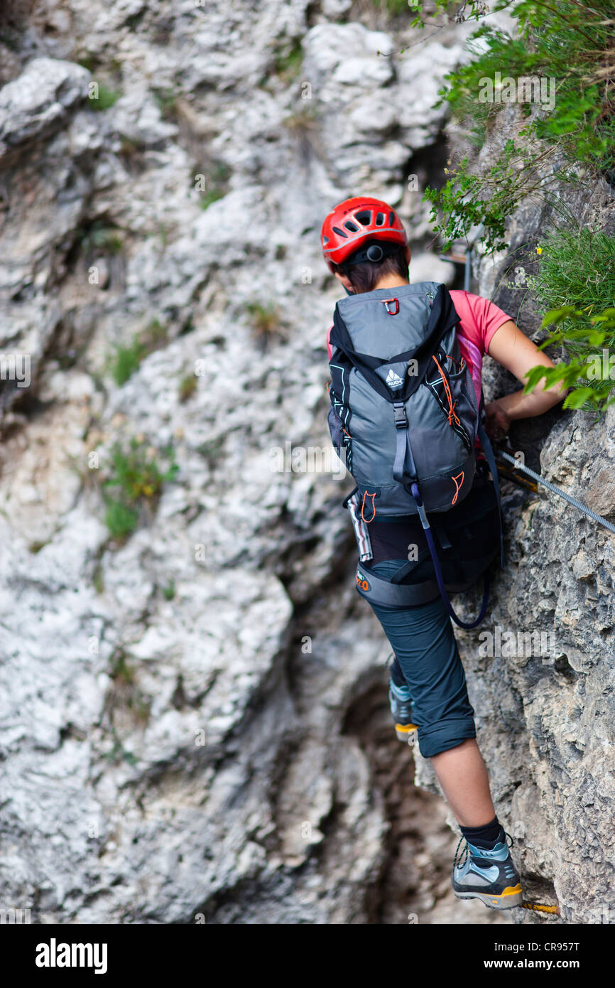 Mountain climber climbing the Rio Secco climbing route in the lowlands ...