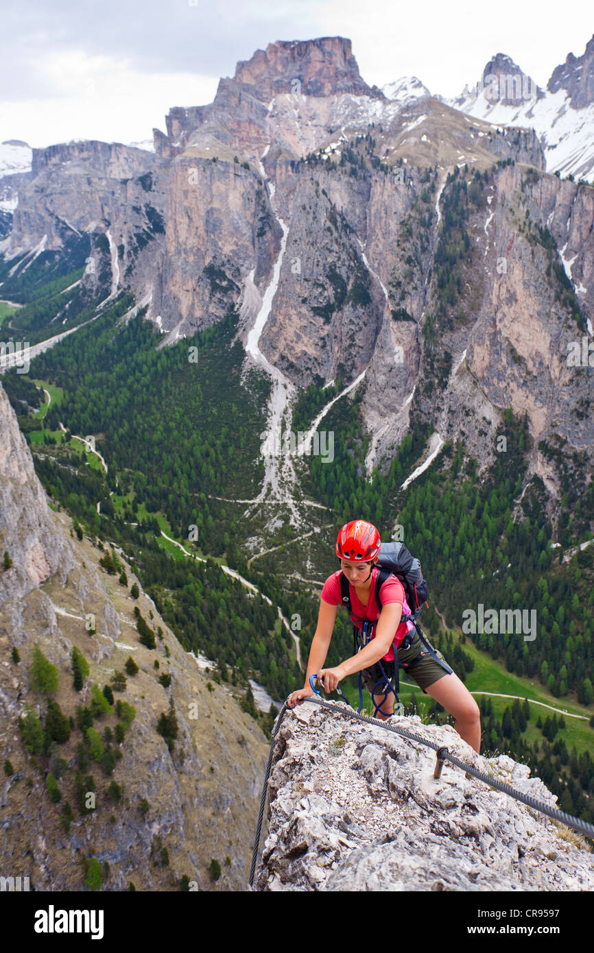 Rock climber climbing the Stevia climbing route in Vallunga in Val ...