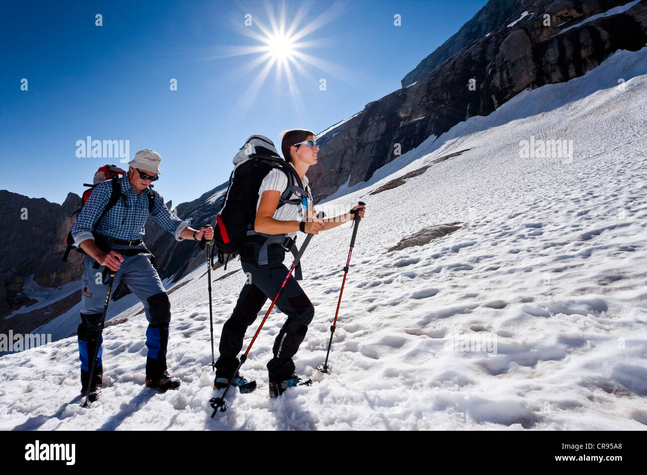 Mountaineers climbing Marmolada mountain, Dolomites, Westgrat fixed ...