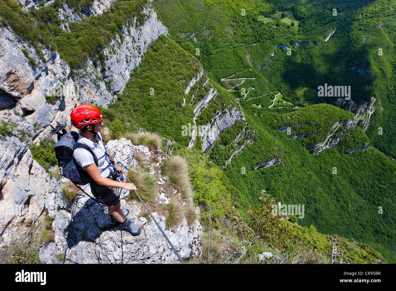 Climber on the Gerardo Sega fixed rope route on Monte Baldo mountain ...