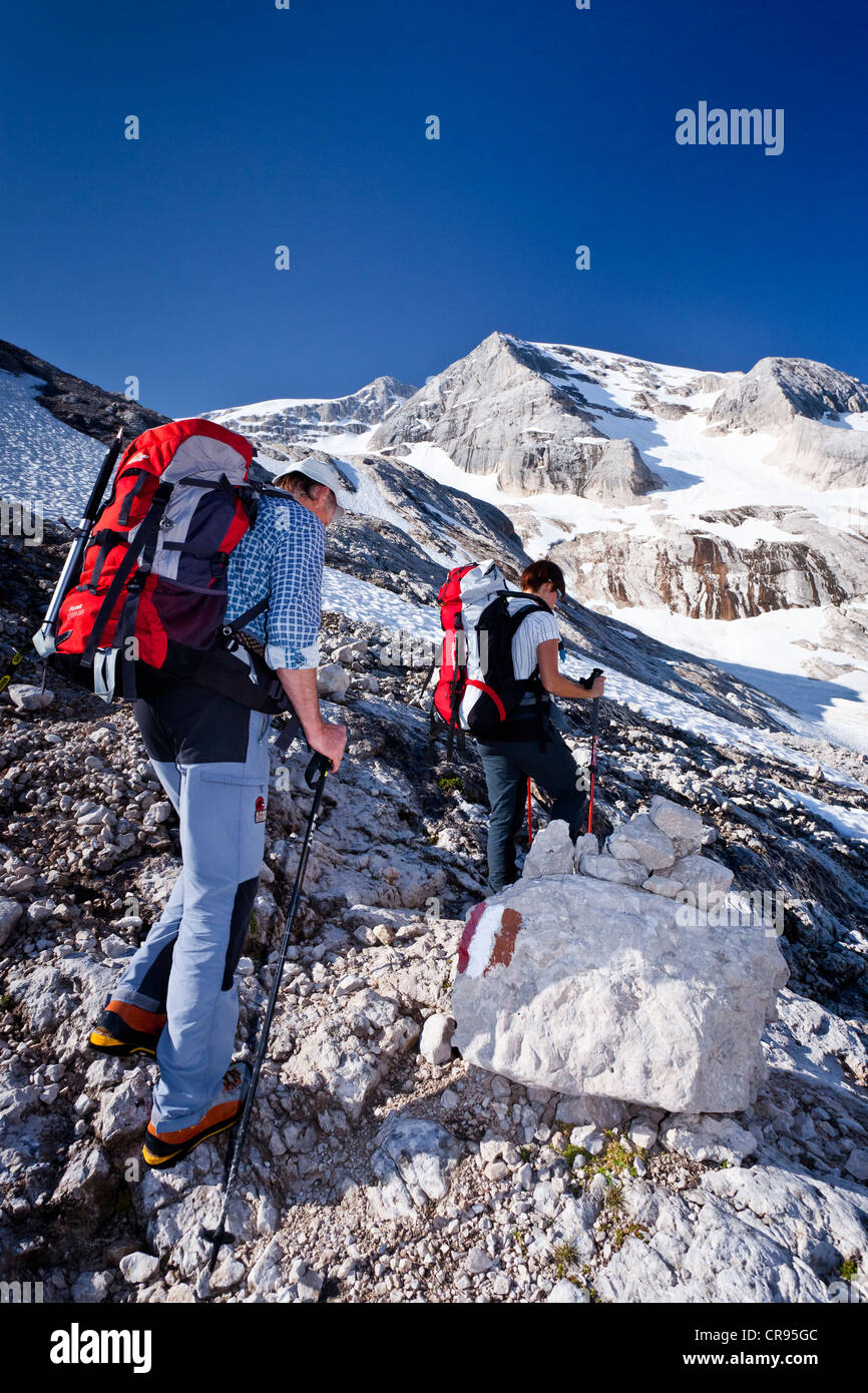 Climbers ascending Mt. Marmolada, Dolomites, Westgrat fixed rope route ...