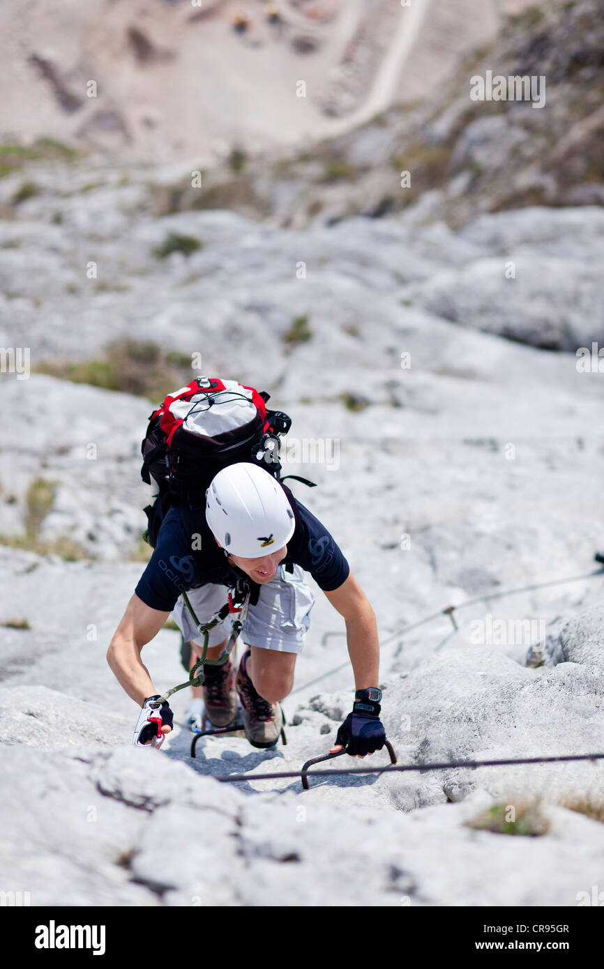 Climber on the Che Guevara fixed rope route on Mt. Monte Casale in the ...