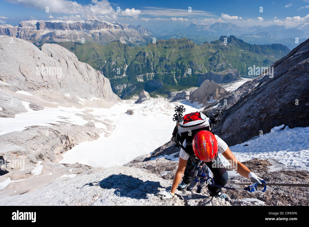 Hikers climbing Mt Marmolata, fixed rope route on west ridge, Mt Sella ...