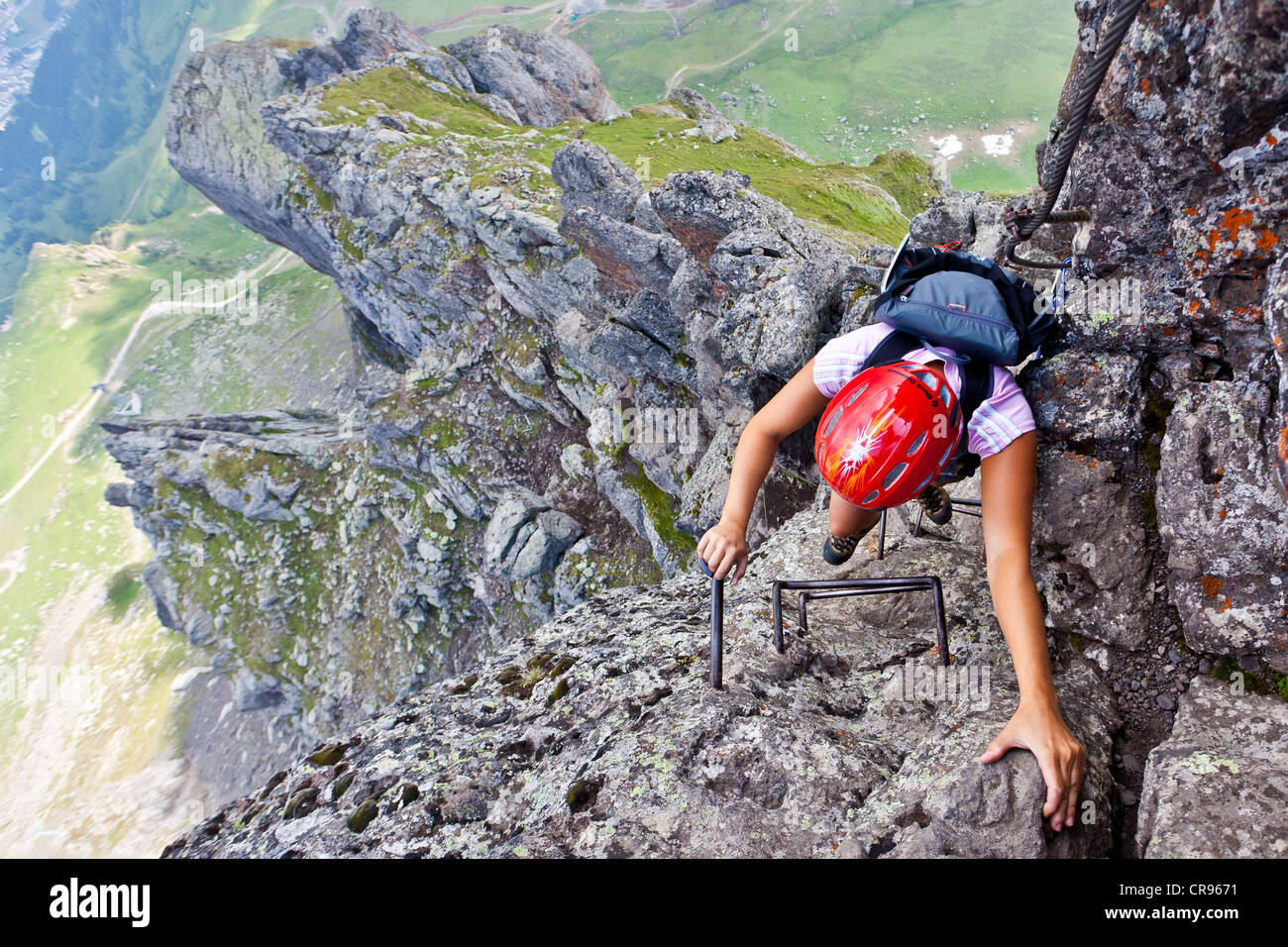 Climber ascending the via ferrata climbing route of the Tofane ...