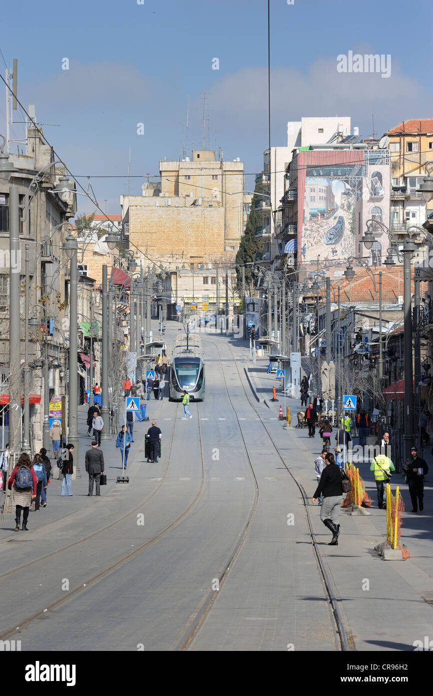 Street scene on the Jaffa Road with Orthodox Jews and the rails of the ...