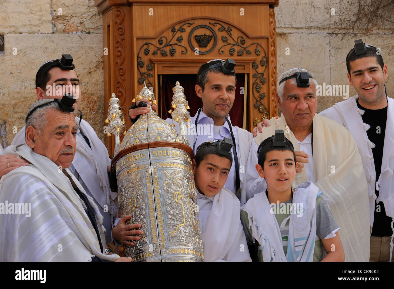 Jewish boy carrying the Torah scroll from the shrine at the Wailing ...