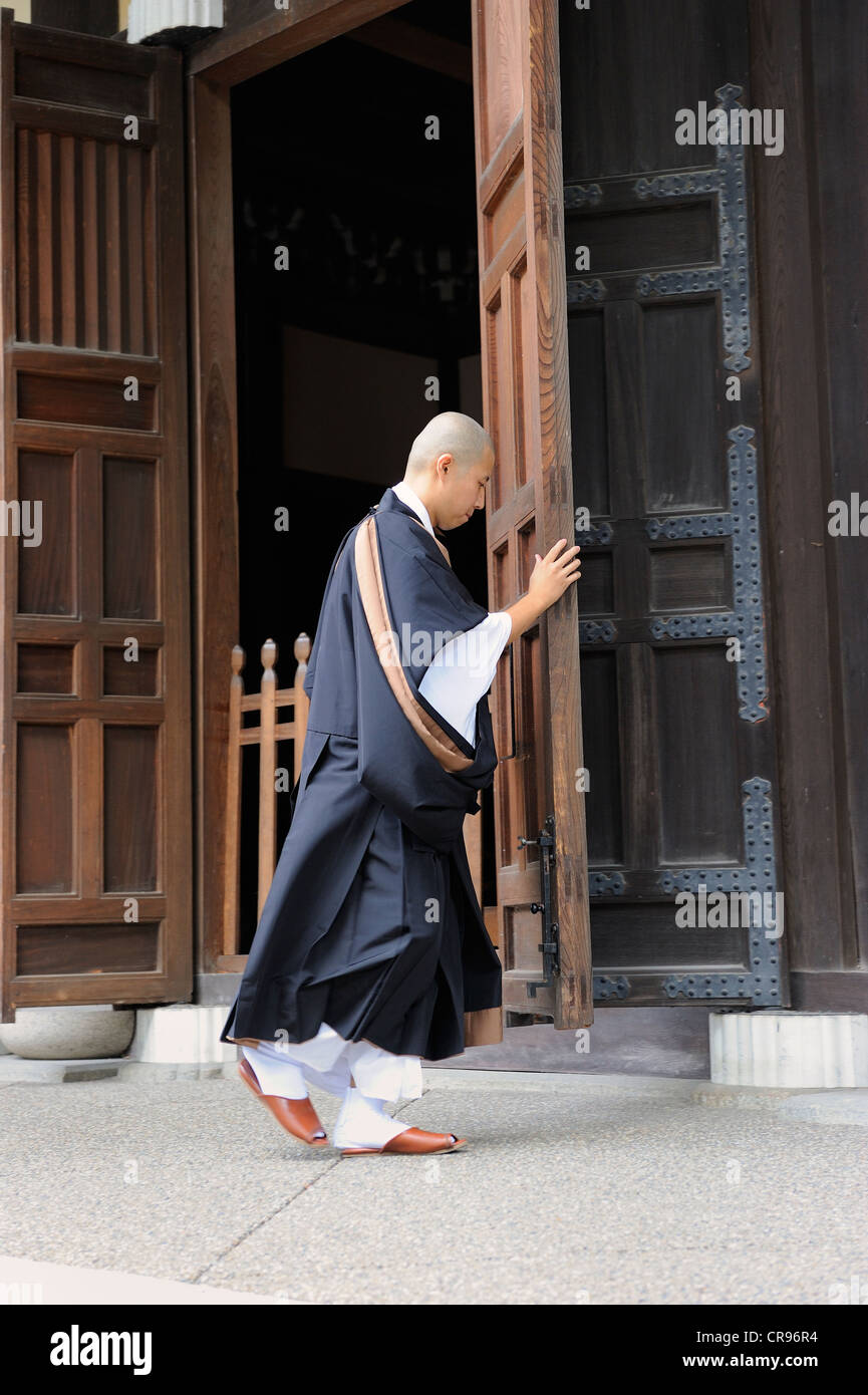 Monk opening door hi-res stock photography and images - Alamy