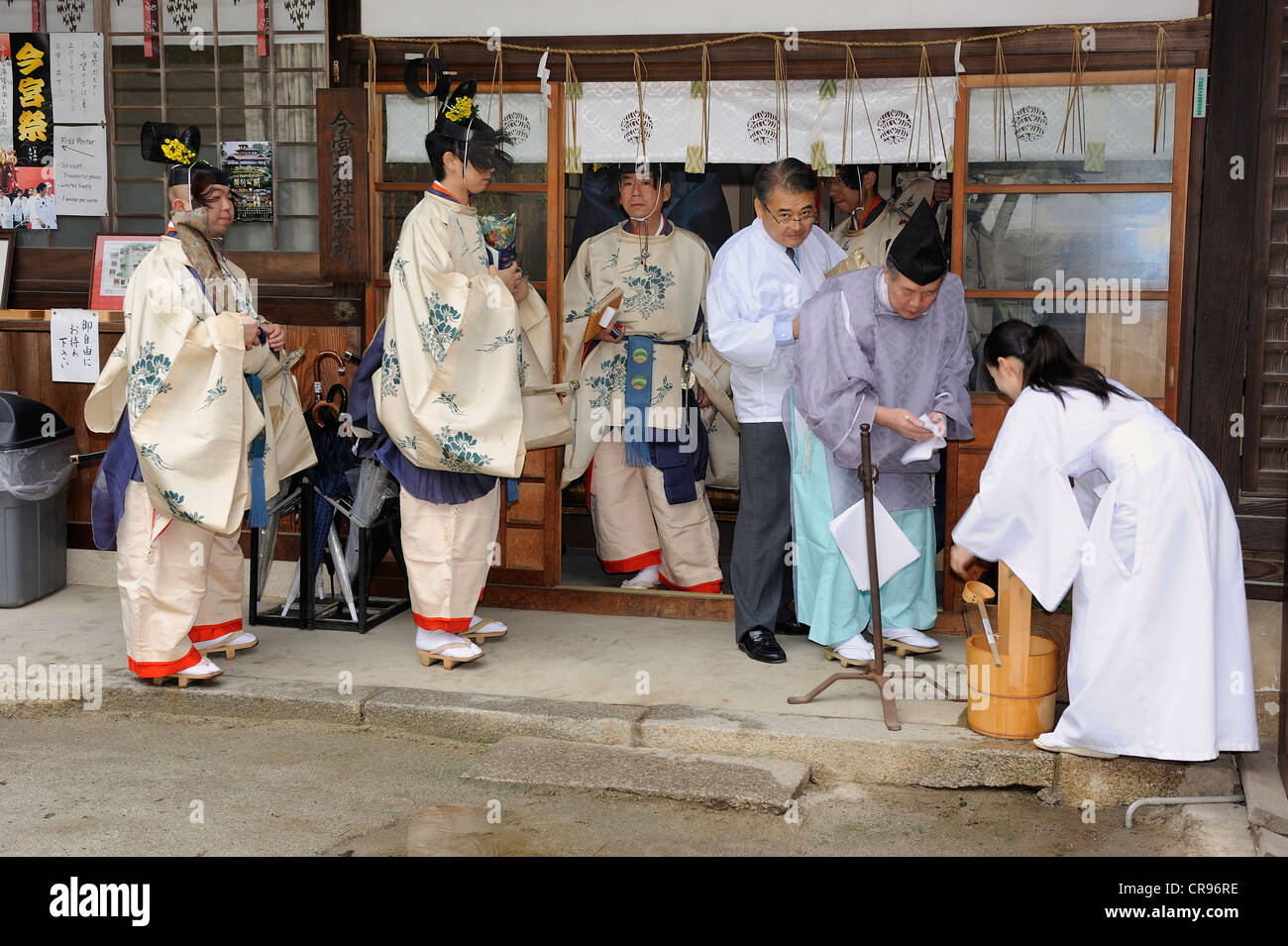 Ritual cleansing before a ceremony in Imamiya Shrine, Autumn Festival ...