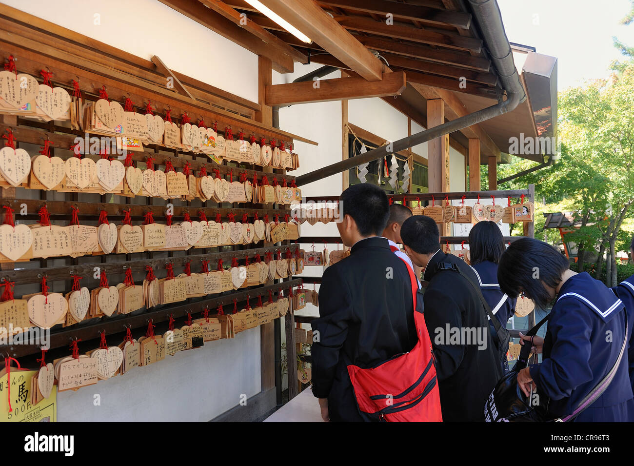 School children wearing sailor uniforms as school uniforms selecting ...