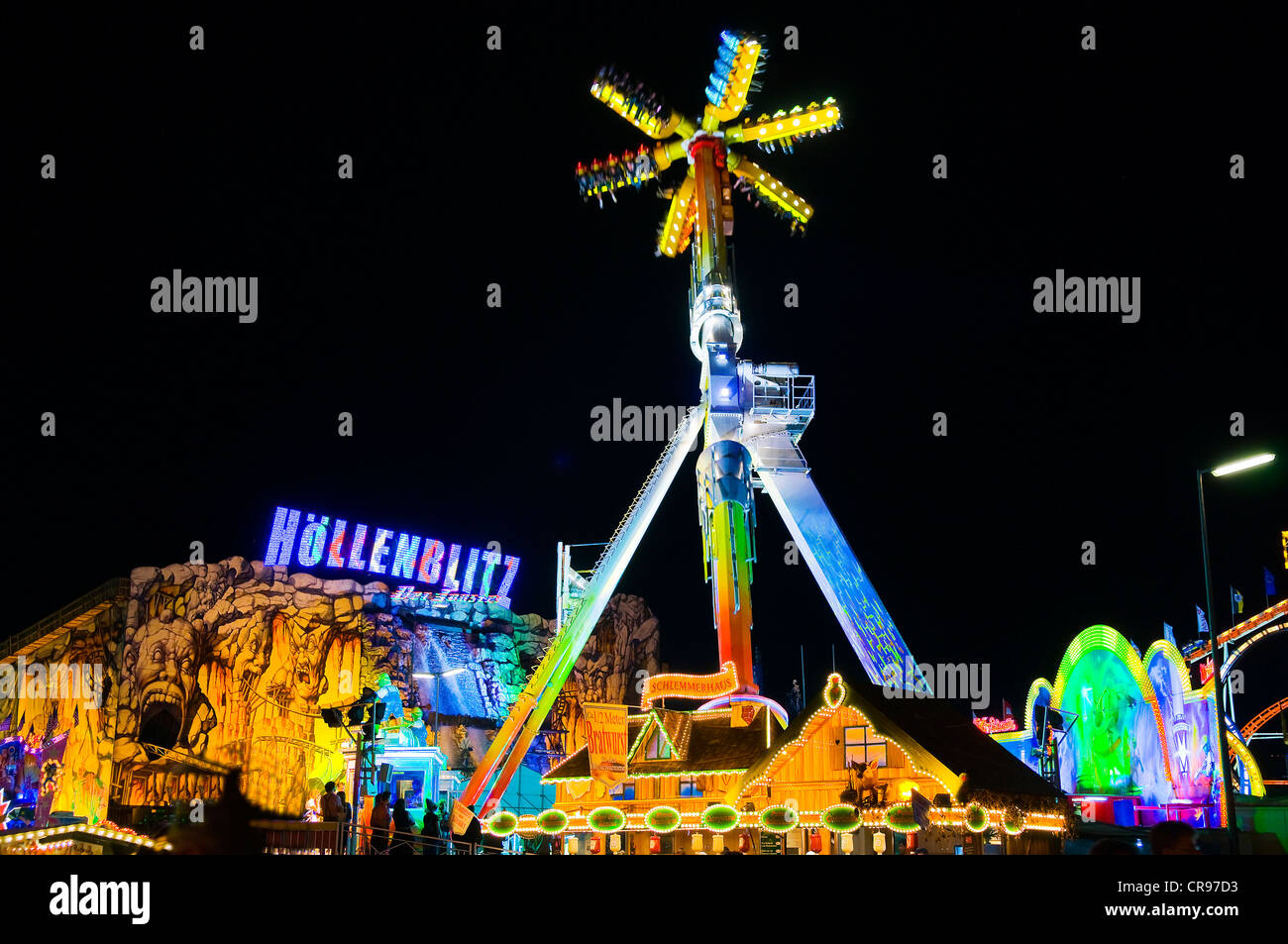 Oktoberfest, Wiesn, amusement rides, giant rotating pendulum at night ...