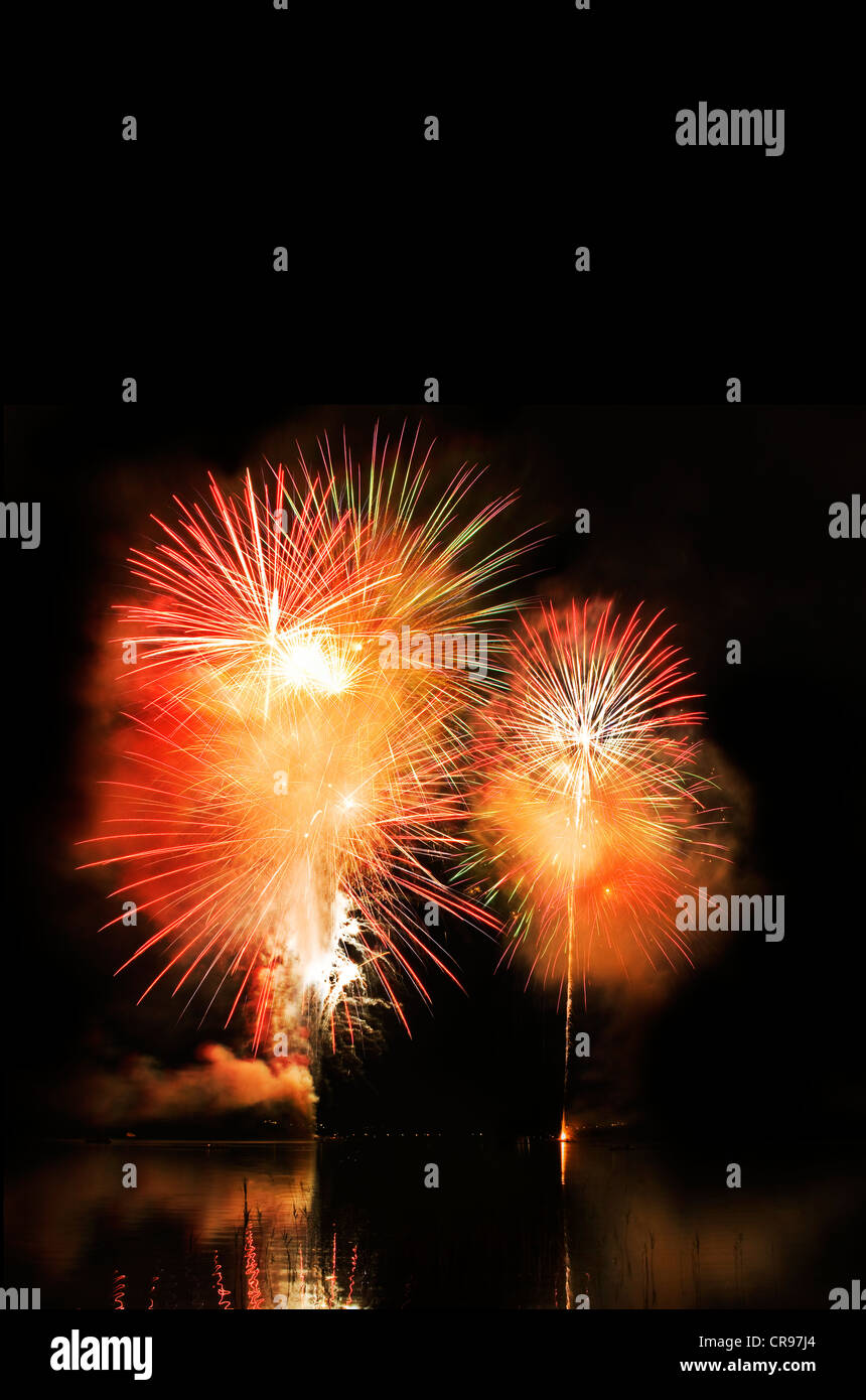 Aerial fireworks display on the lake, double mushroom clouds with ...