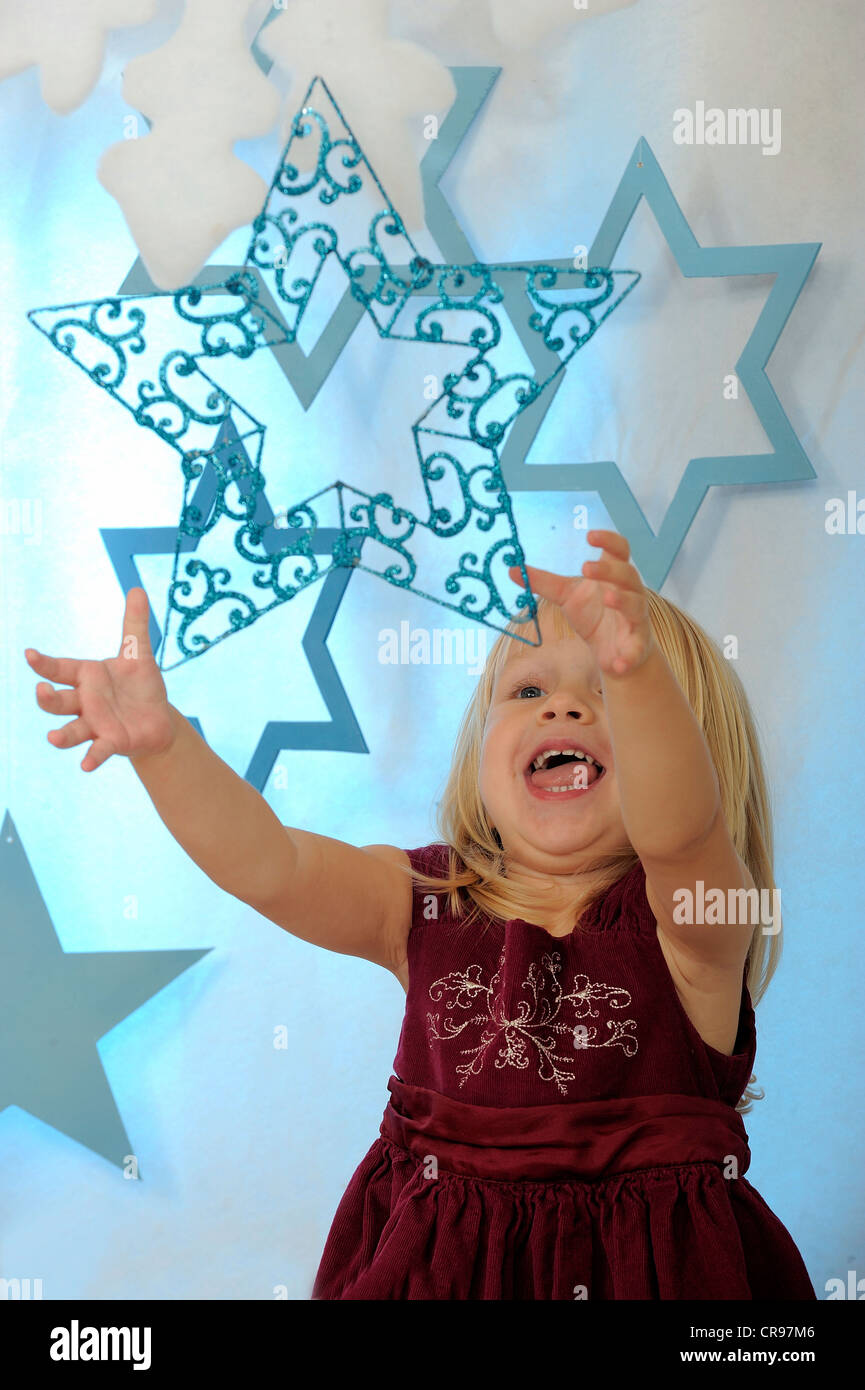 Little girl with stars Stock Photo - Alamy