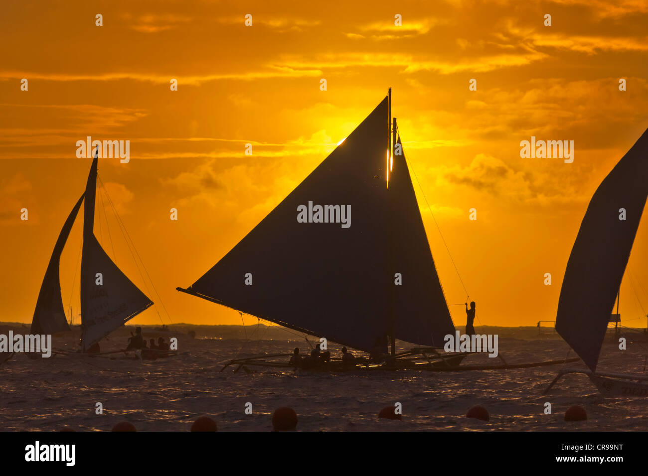 Sail boats in the ocean at sunset, Boracay Island, Aklan Province ...